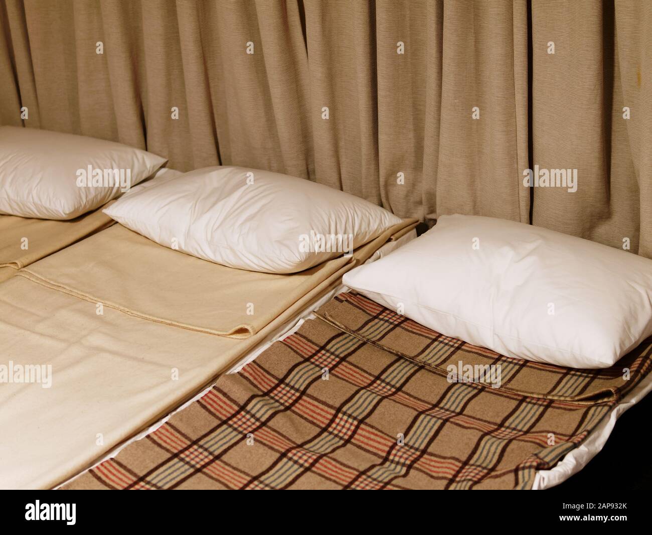 Temporary beds for disaster refugees at an emergency shelter Stock ...