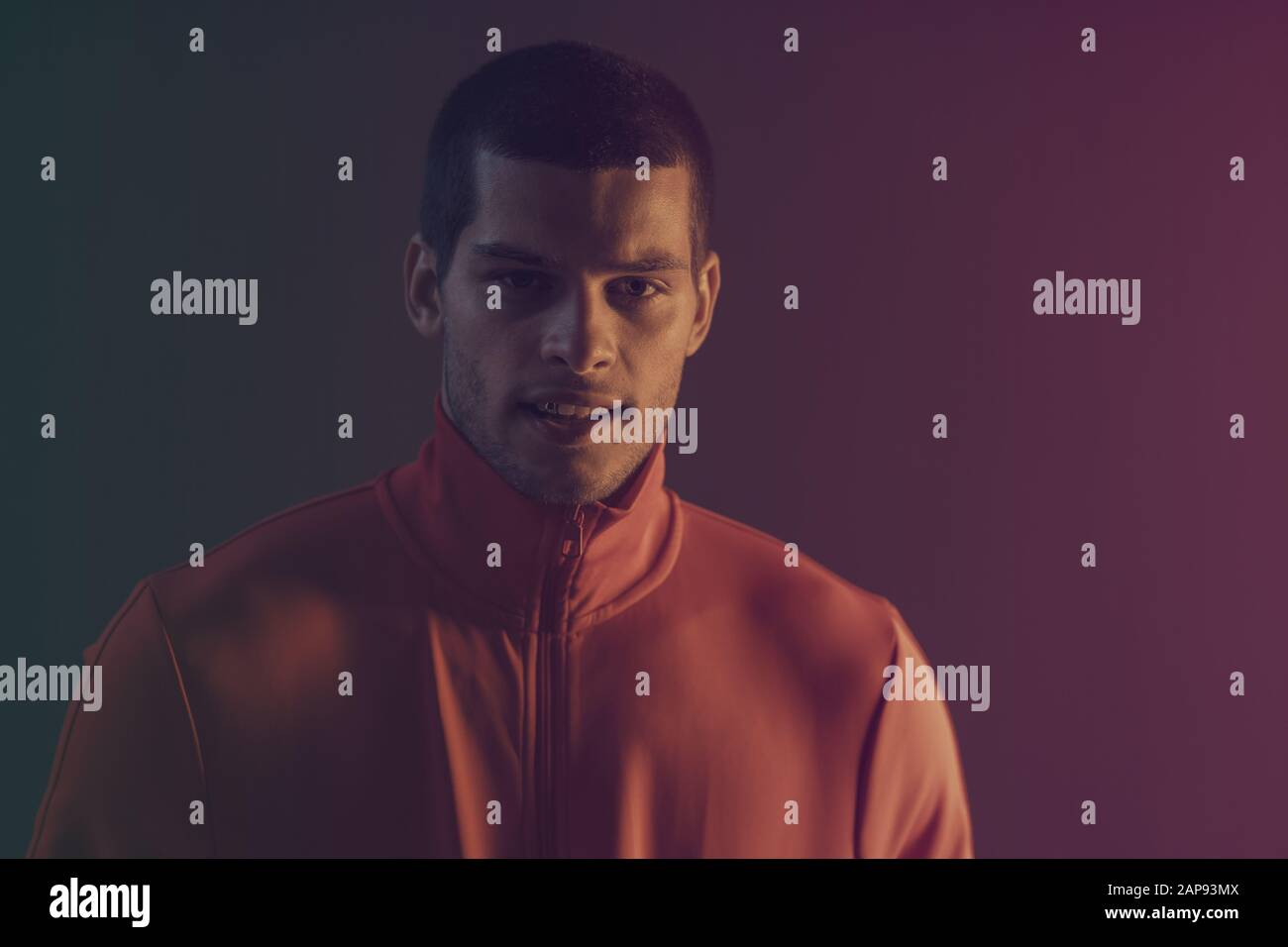 Close-up portrait of attractive male model. Retro wave portrait of a ...