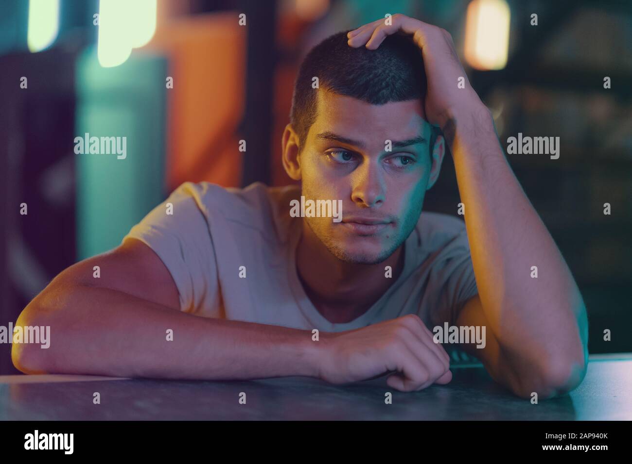 Close-up portrait of attractive male model. Retro wave portrait of a ...