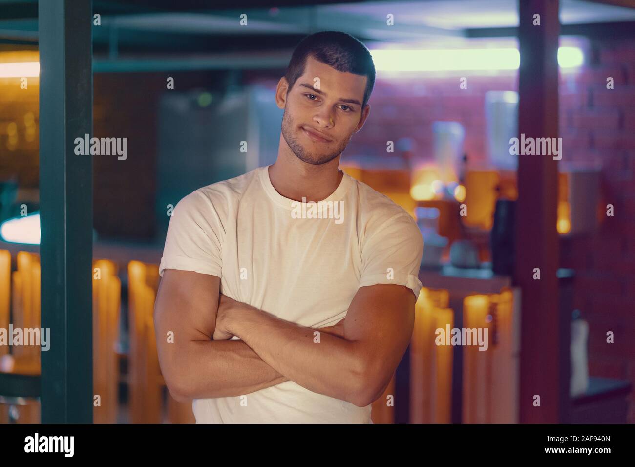 Close-up portrait of attractive male model. Retro wave portrait of a ...