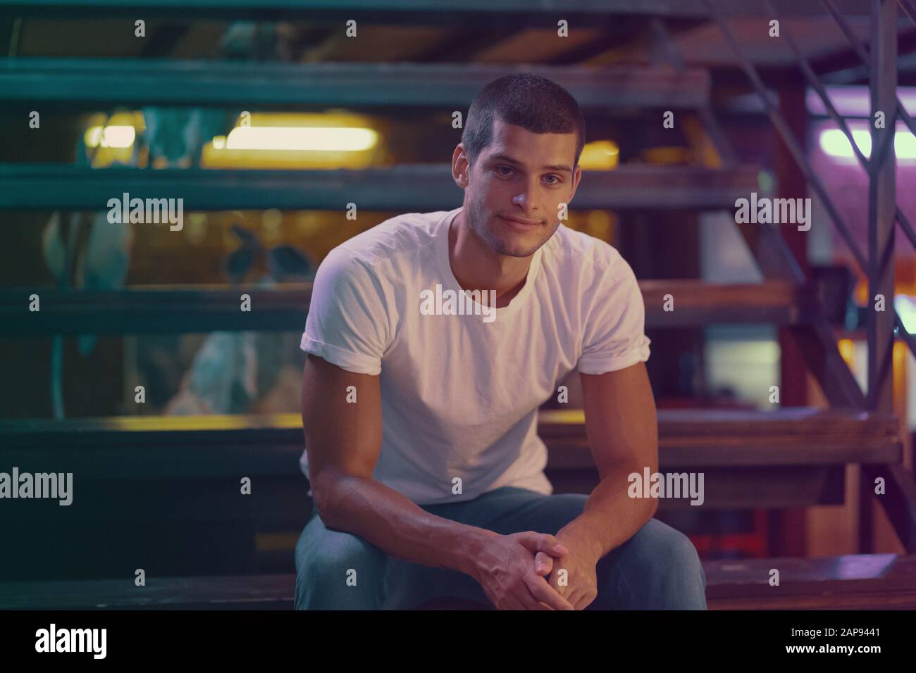 Close-up portrait of attractive male model. Retro wave portrait of a ...