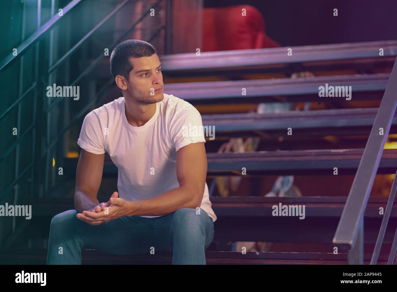 Close-up portrait of attractive male model. Retro wave portrait of a ...