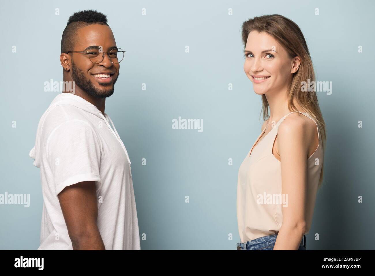 Smiling multiracial people posing isolated on studio background Stock ...