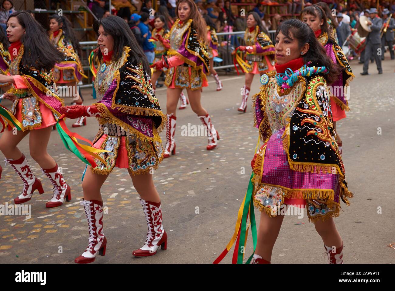Diablada dancers in ornate costumes parade through the mining city of ...