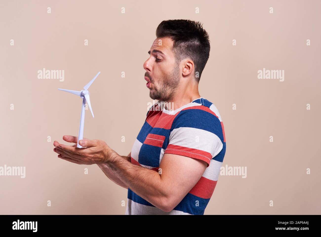 Adult man blowing in the wind hi-res stock photography and images - Alamy