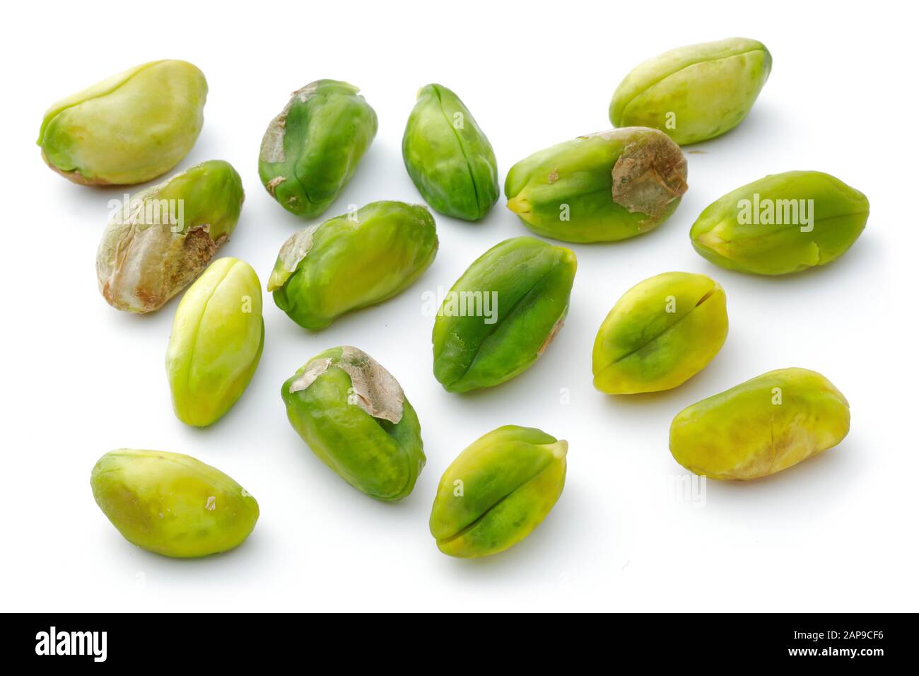 Heap of peeled pistachio nuts isolated on white background Stock Photo ...