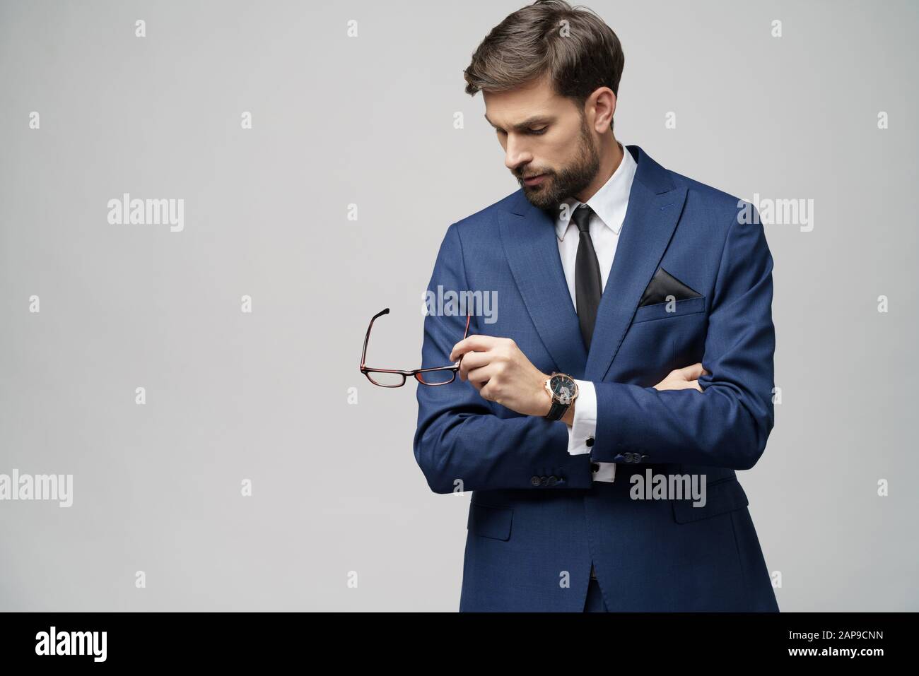 studio photo of young handsome stylish businessman wearing suit Stock ...