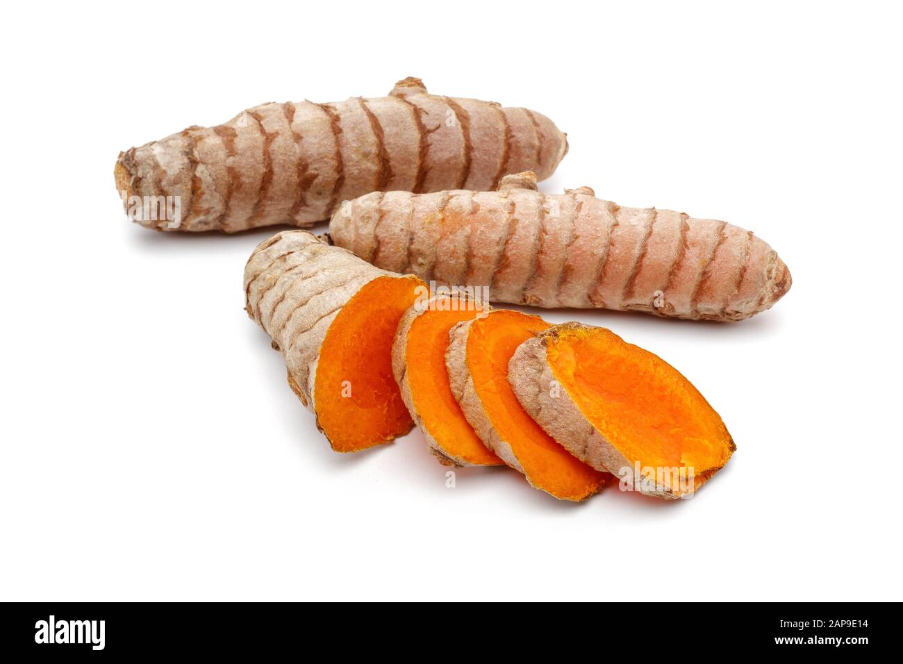 Fresh turmeric with slices isolated on white background Stock Photo - Alamy