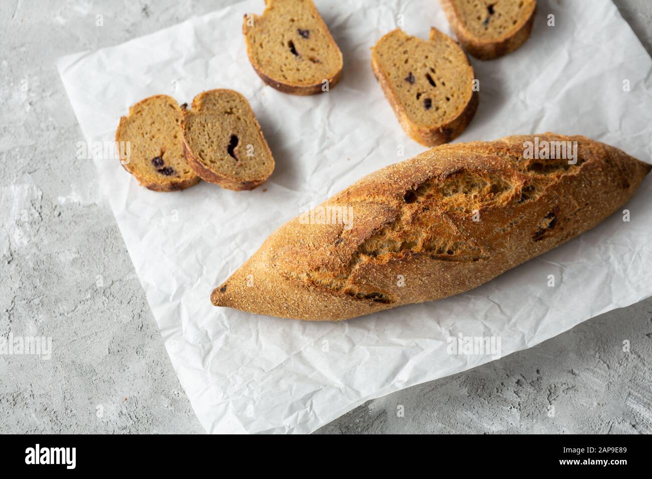Fresh loaf bread top view on white, whole grain Stock Photo - Alamy