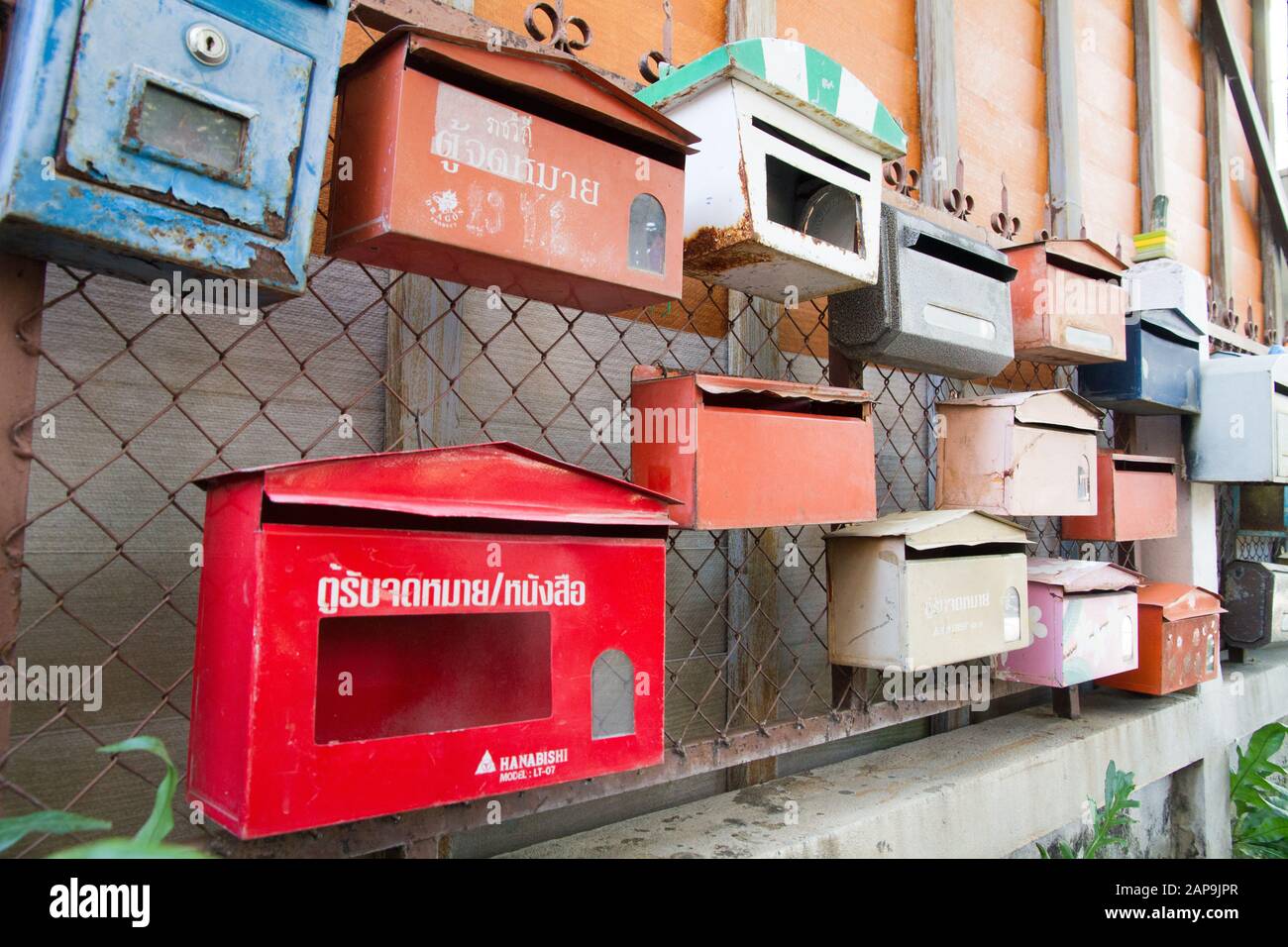 Old style postal boxes on wall, Chiang Mai Thailand Stock Photo - Alamy
