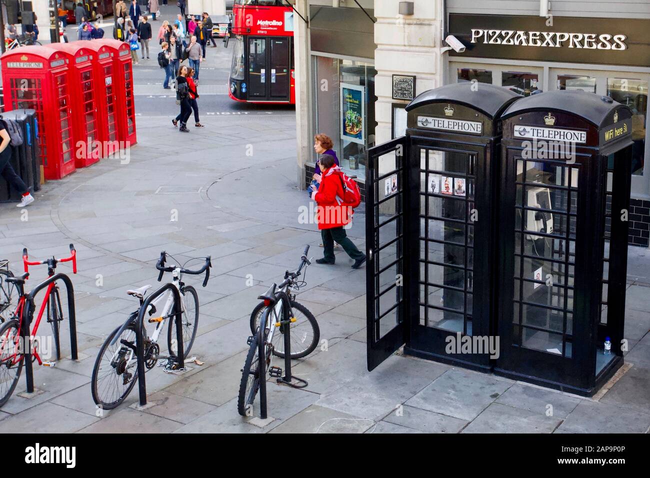 Red & Black Telephone boxes, London, England Stock Photo - Alamy