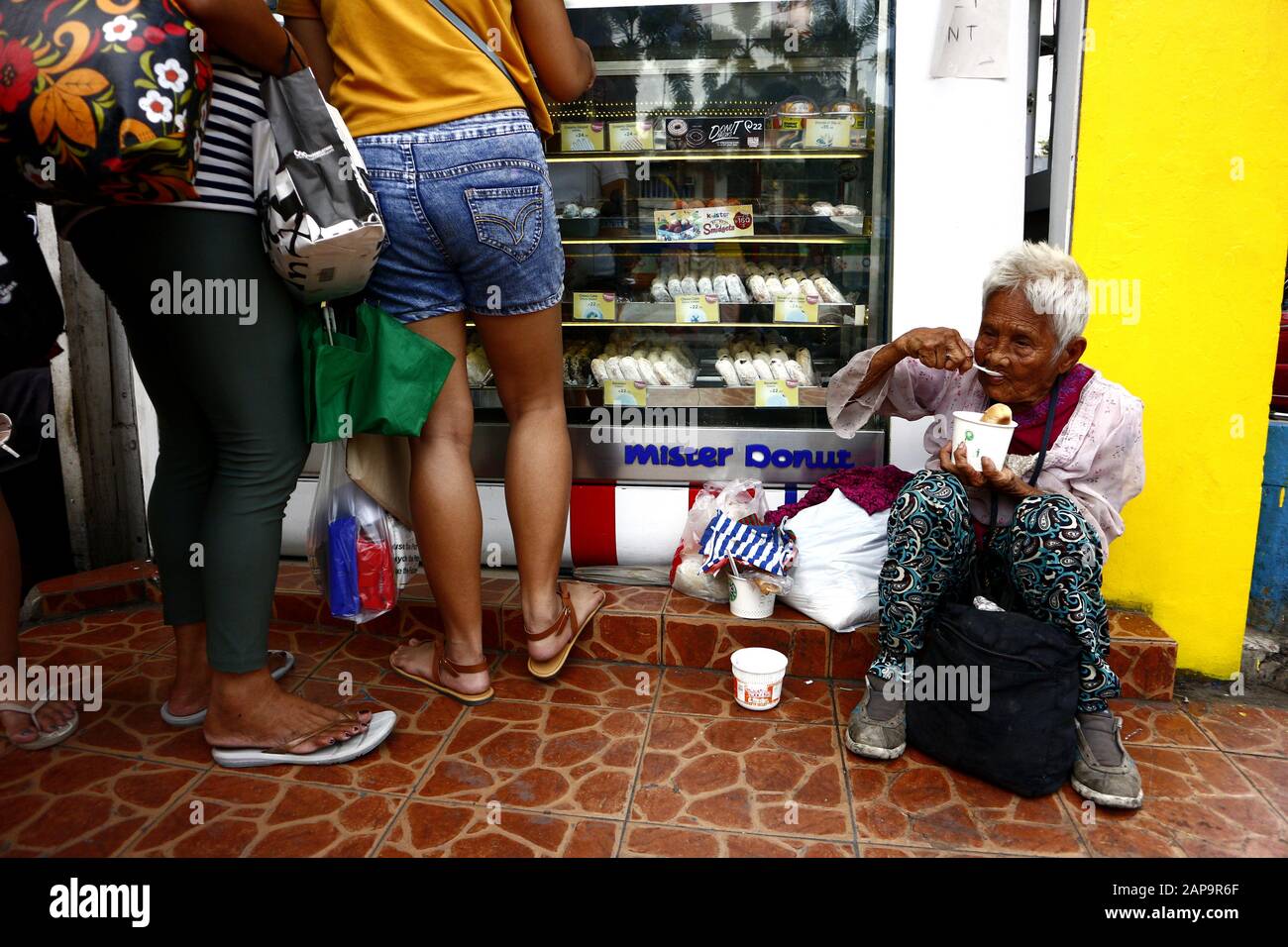 Antipolo City, Philippines - January 18, 2020: Old Filipino woman sit ...