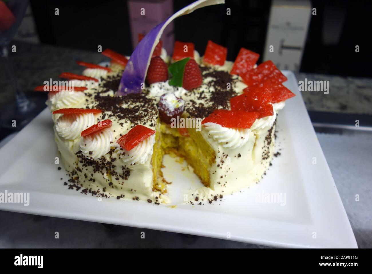 Iced Lemon Sponge Cake Decorated with Raspberry's, Cream & Chocolate ...