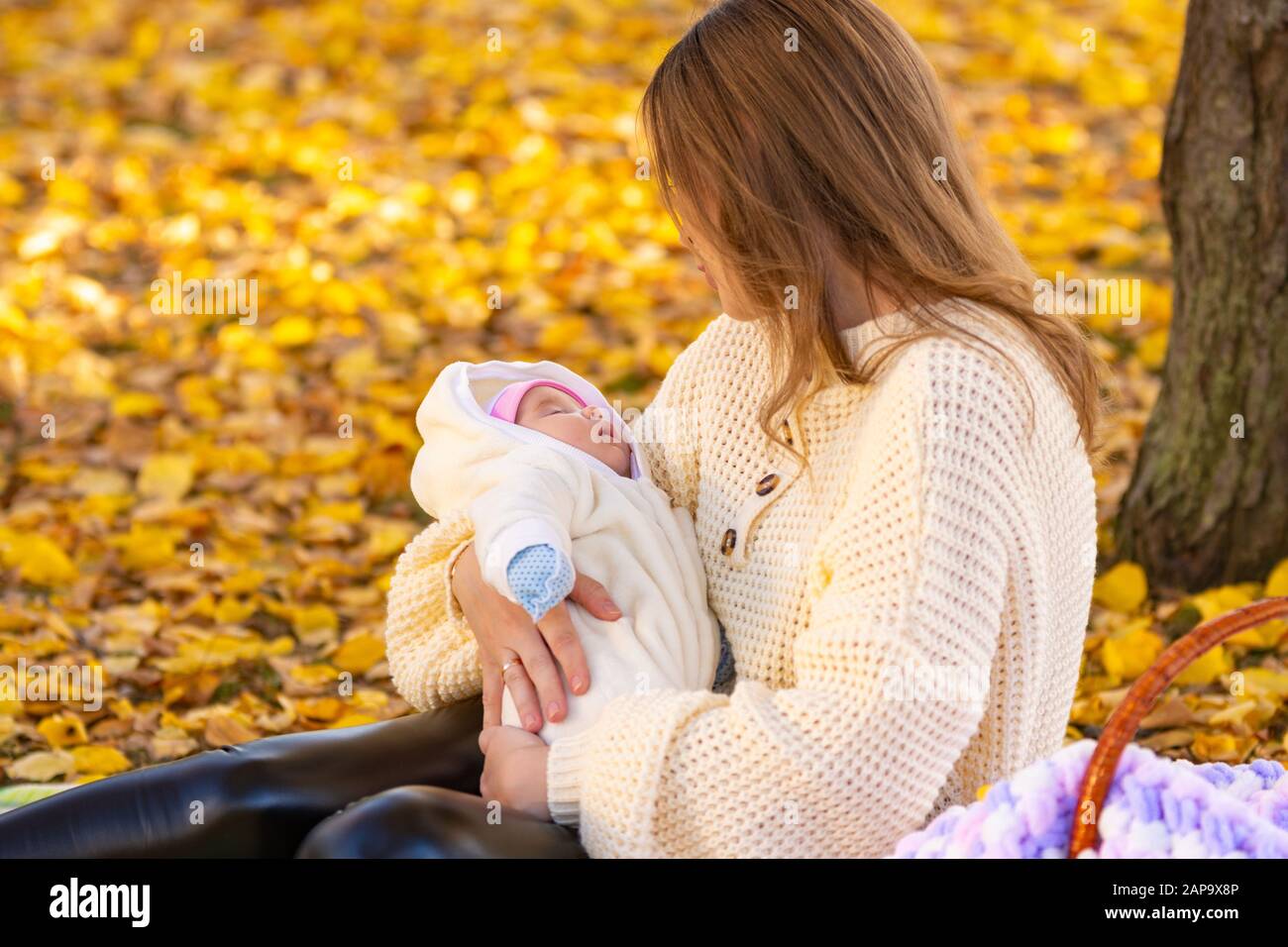 Woman crouched with child hi-res stock photography and images - Alamy