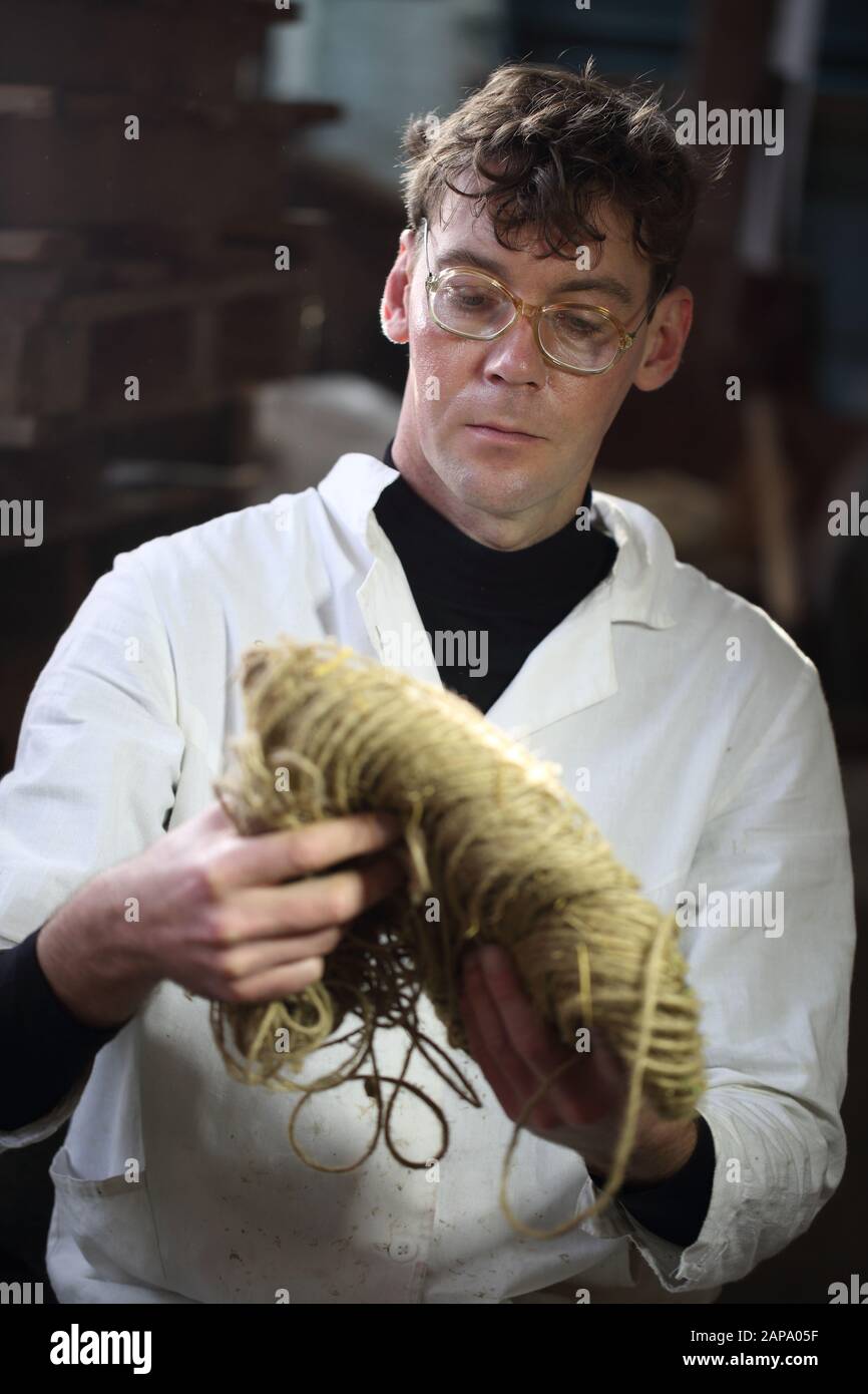 Scientist holds threads made from hemp for packaging Stock Photo - Alamy