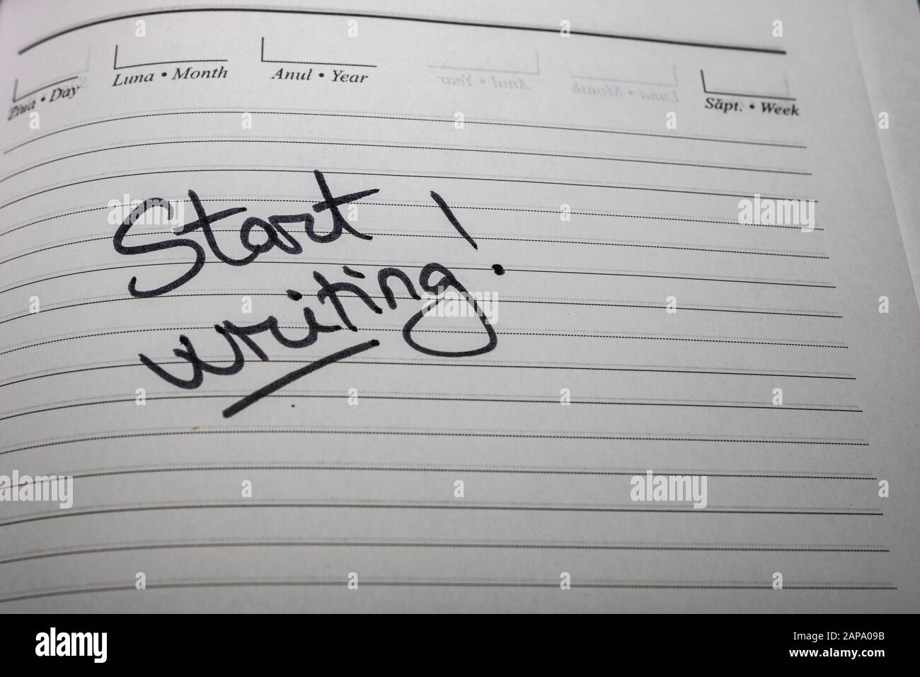 Start writing, handwriting text on page of office agenda. Copy space ...