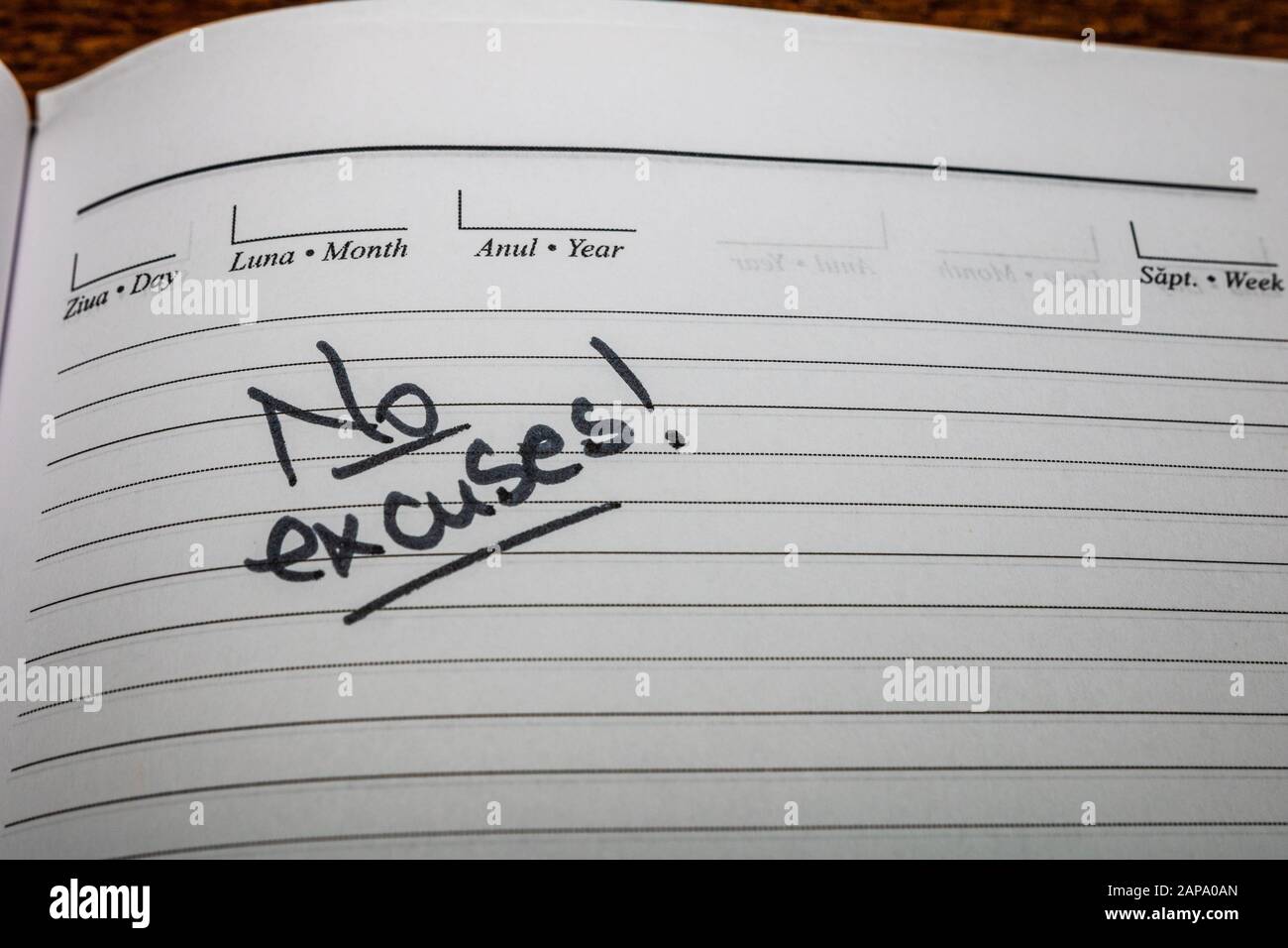 No excuses, handwriting text on page of office agenda. Copy space Stock ...