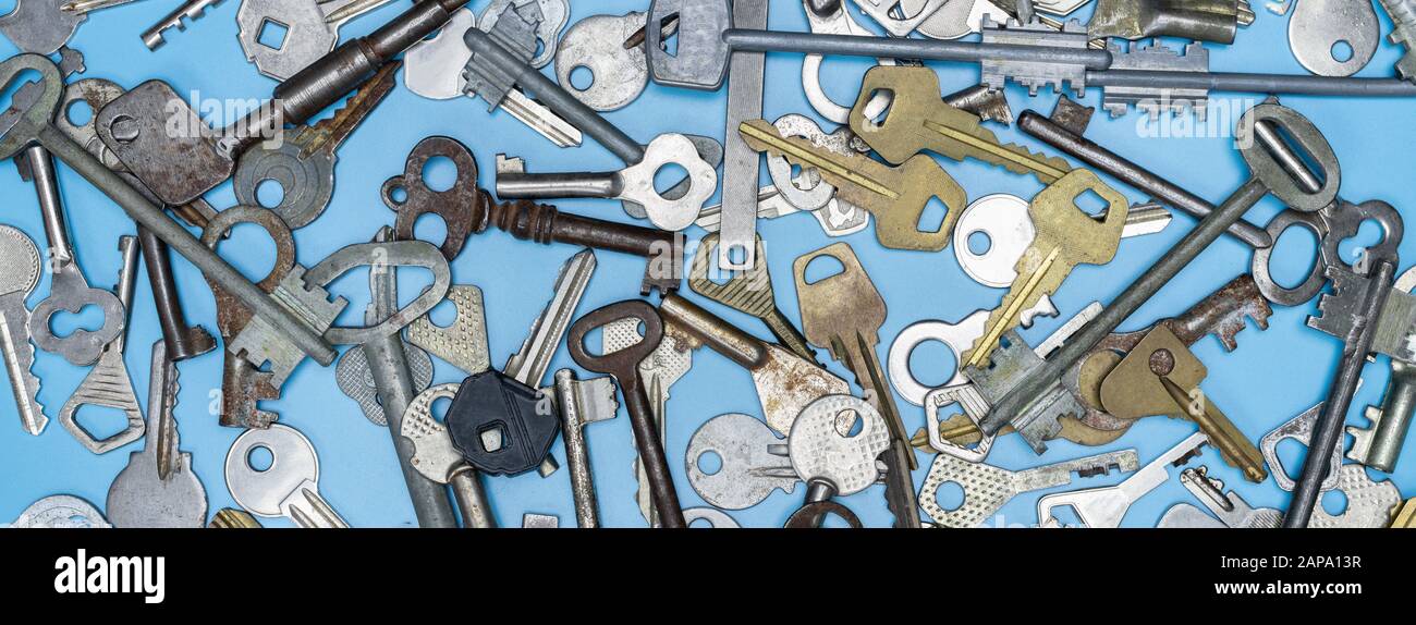 Keys set on blue background. Door lock keys and safes for property ...