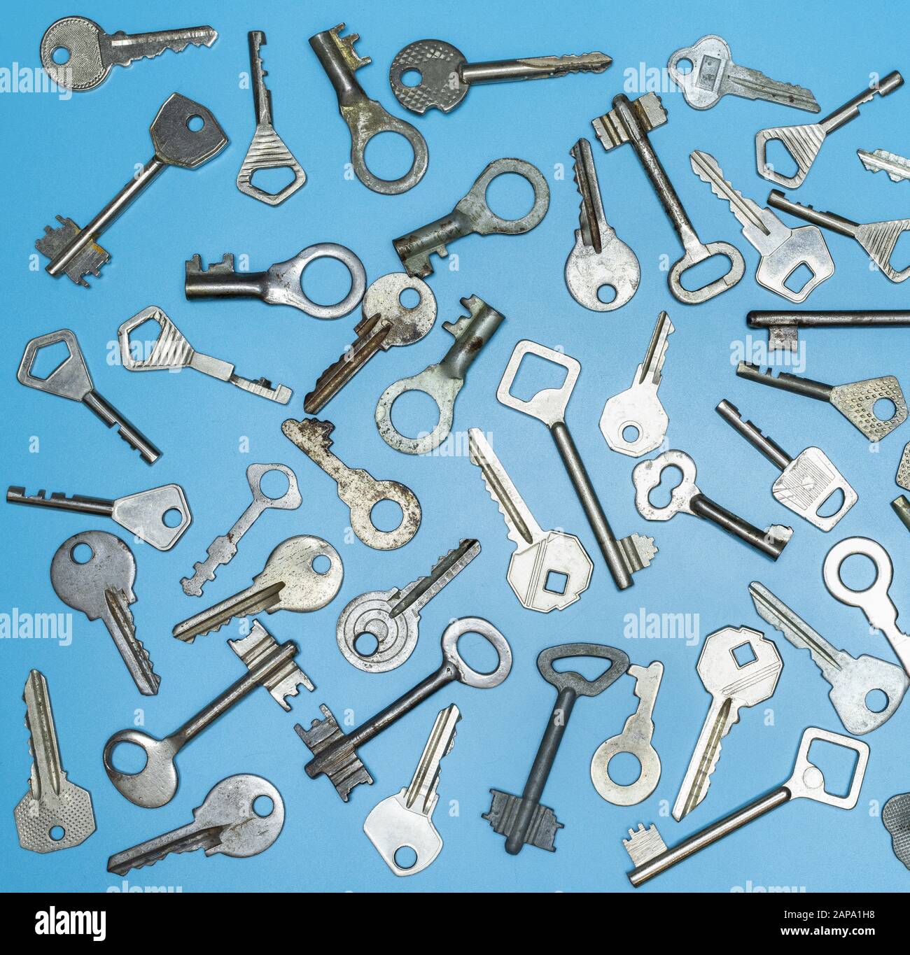 Keys set on blue background. Door lock keys and safes for property ...
