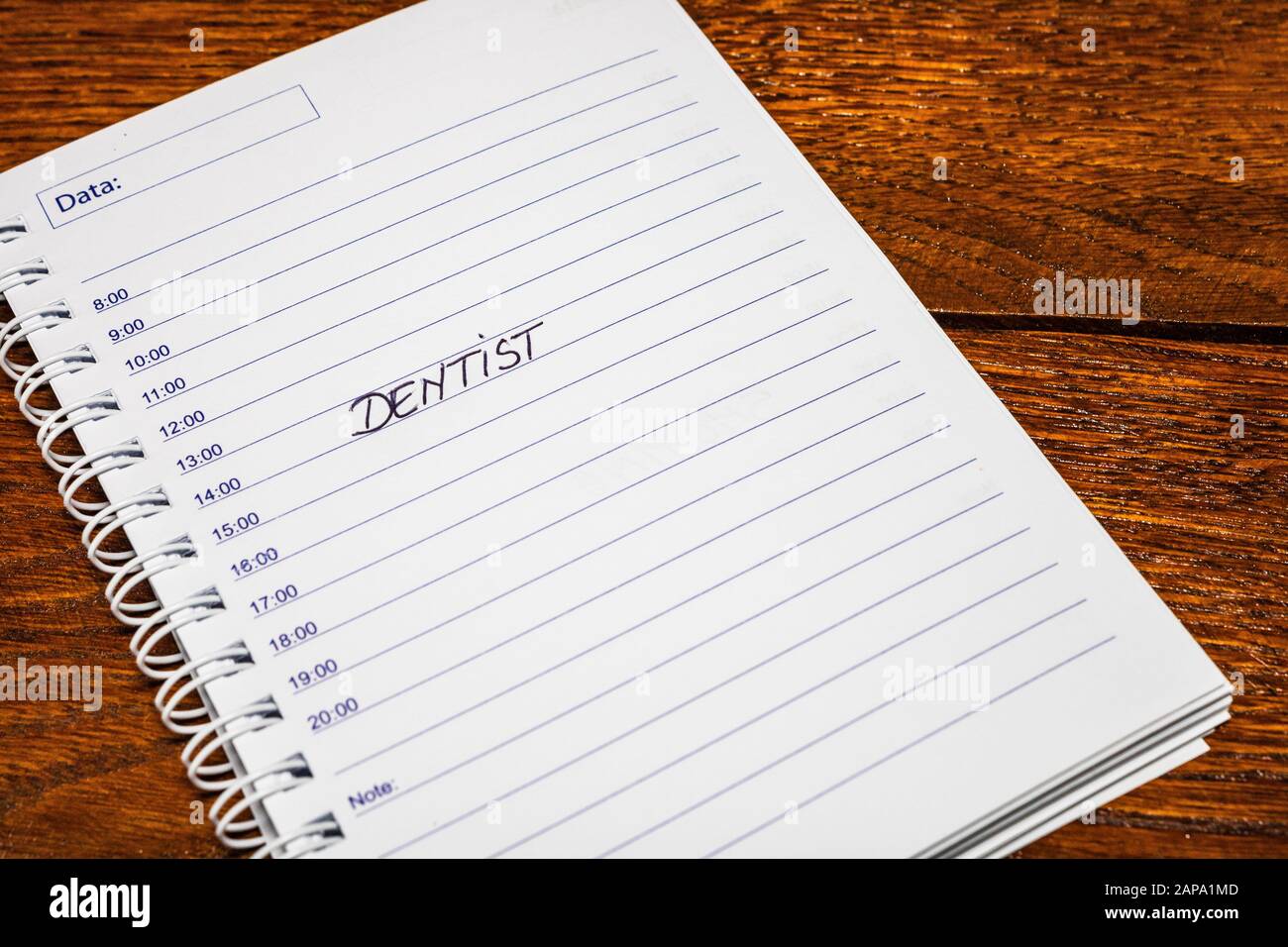 Dentist, handwriting text on page of office agenda. Copy space Stock ...