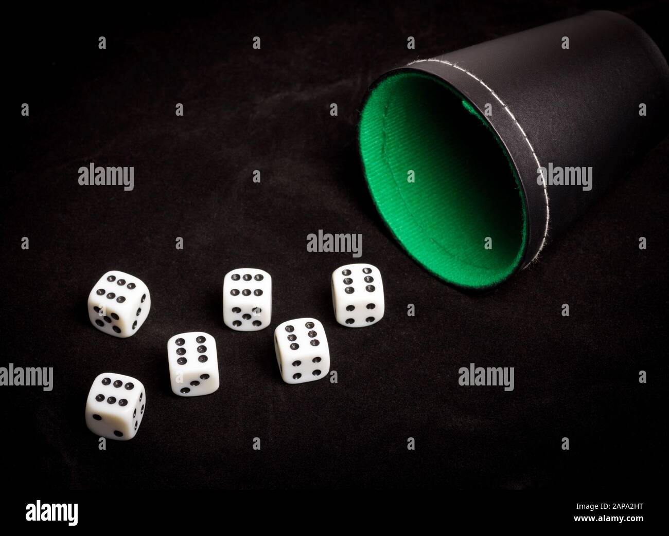 Six dice with number six facing up on black board Stock Photo - Alamy