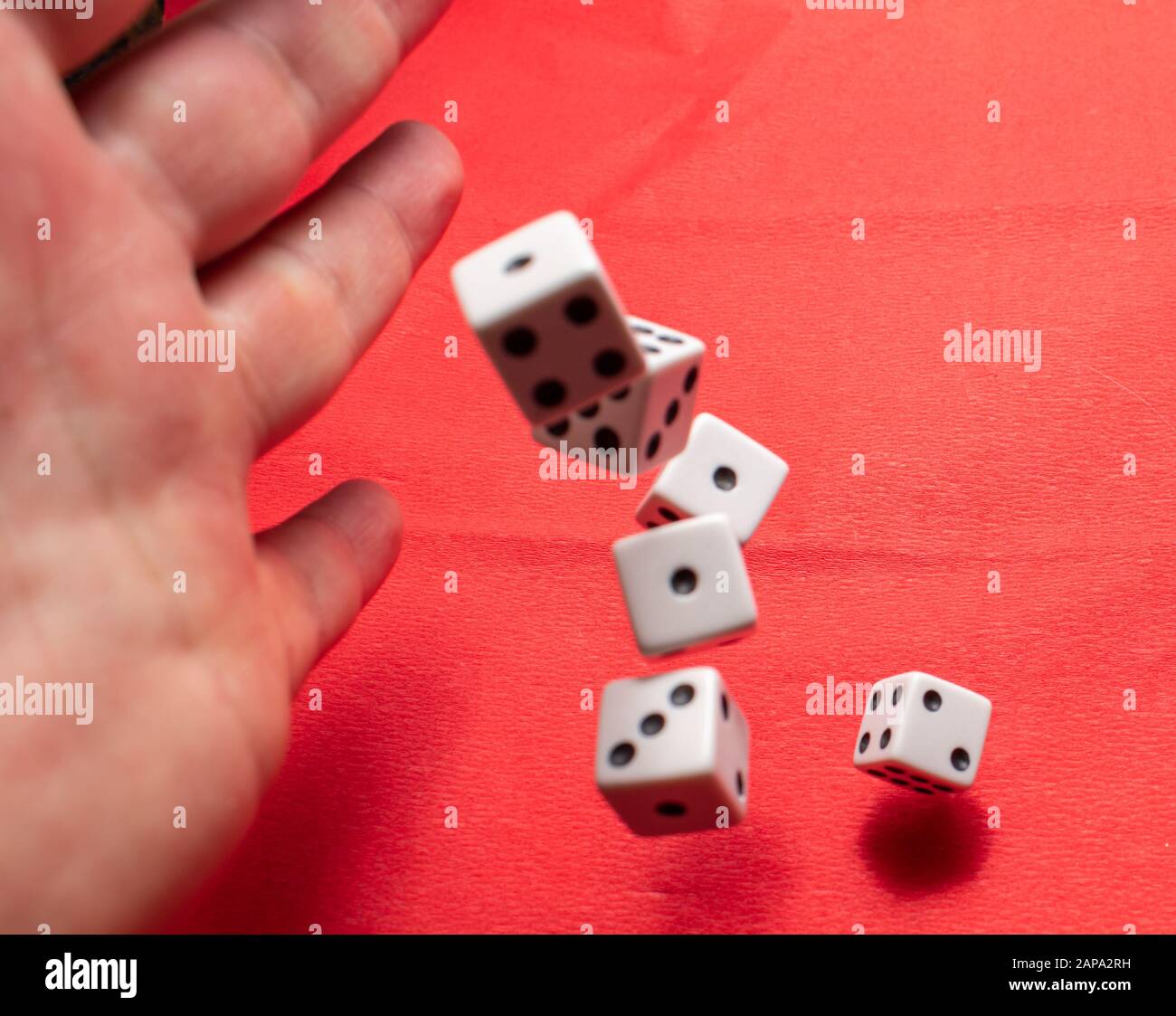 Hand throwing dice hi-res stock photography and images - Alamy