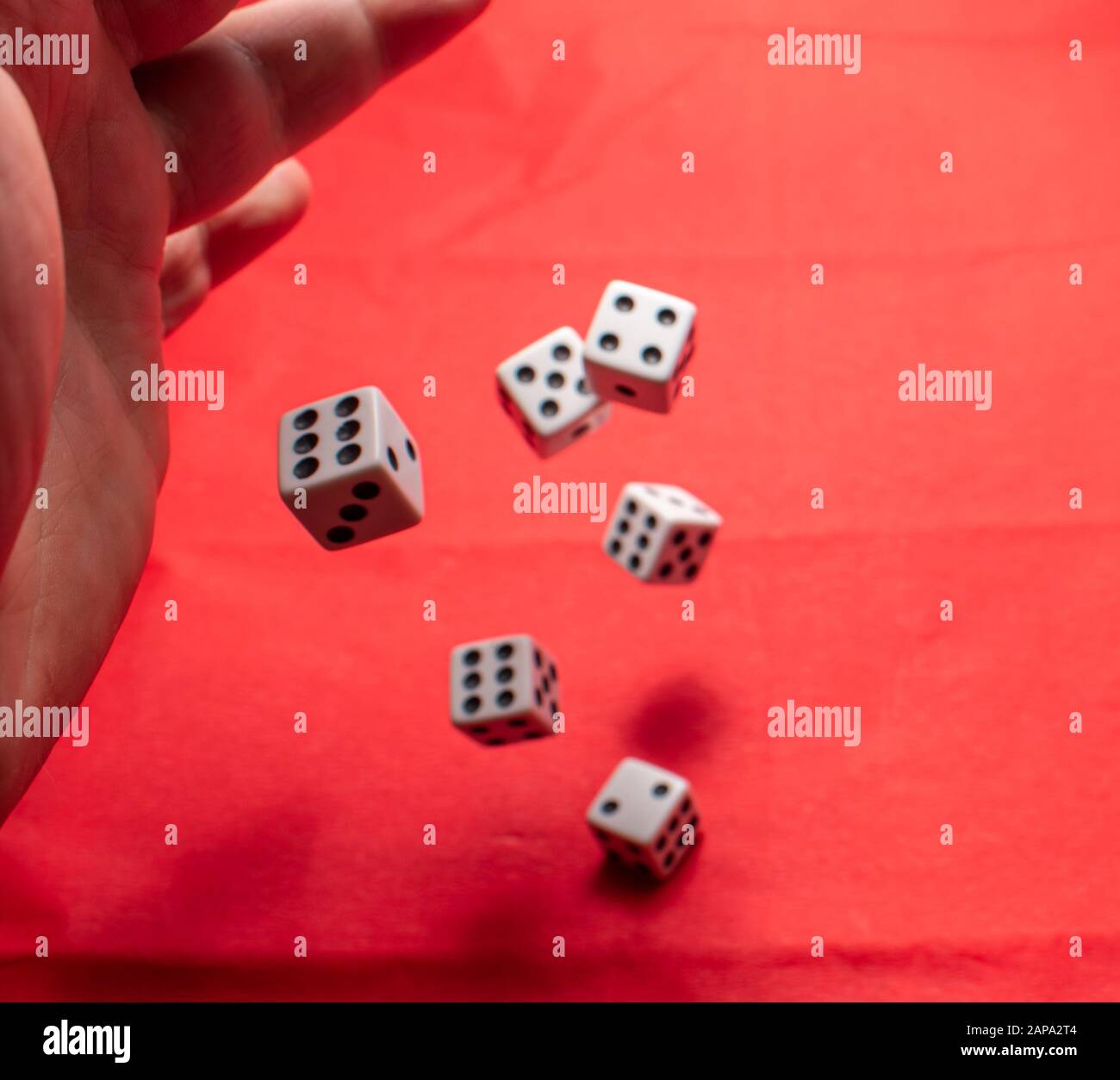 Hand throwing dice hi-res stock photography and images - Alamy