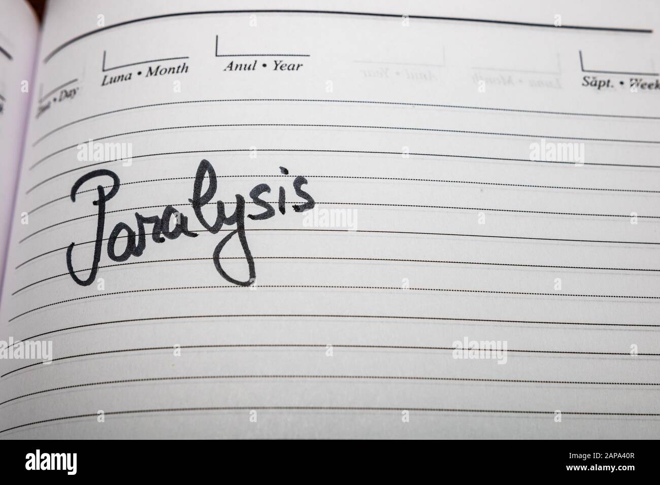 Paralysis, handwriting text on page of office agenda. Copy space Stock ...