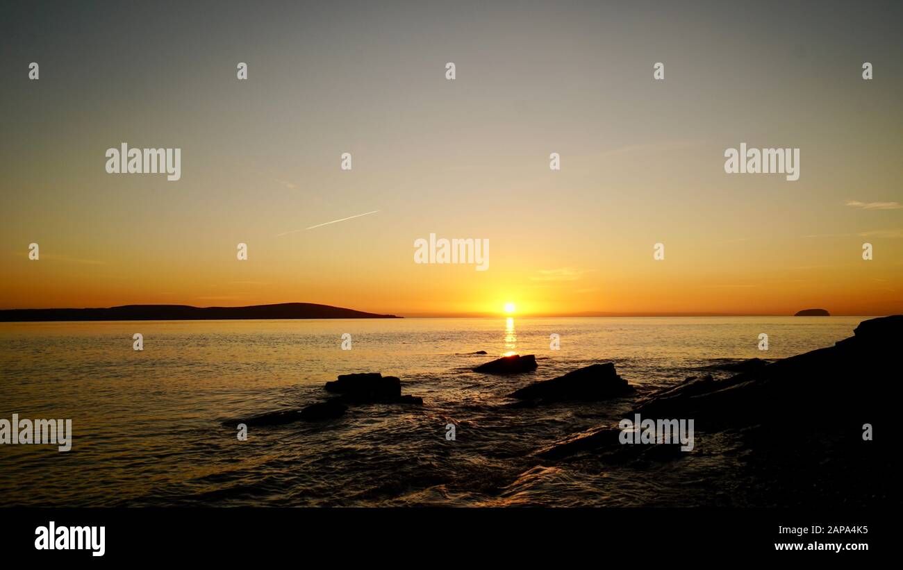 Sunset viewed from Marine Lake, on the seafront at Weston-super-Mare ...