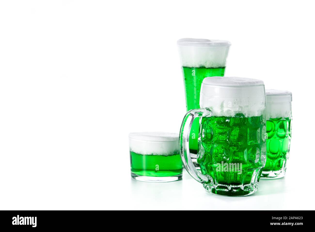 Traditional St Patrick's Day green beers isolated on white background ...