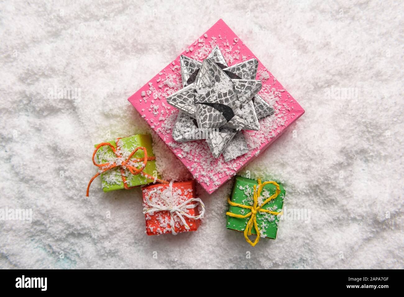 christmas presents nicely decorated with bows and feathers. view from ...