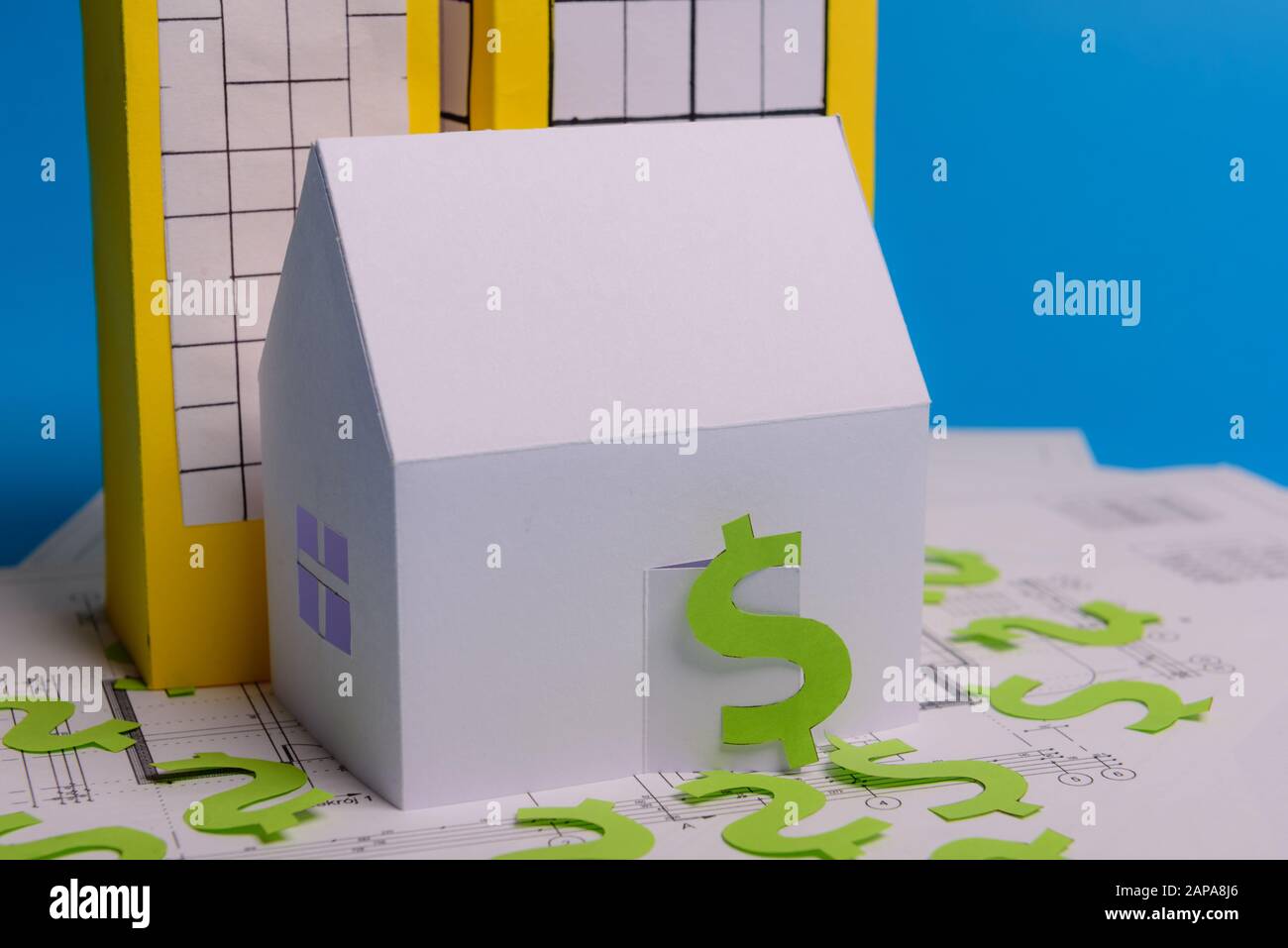 Paper skyscrapers , us dollar money, house projects plan and blueprints ...