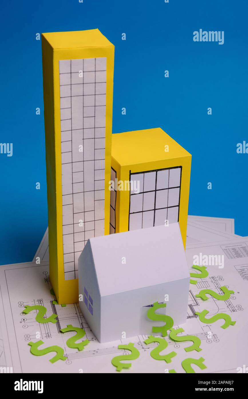 Paper skyscrapers , us dollar money, house projects plan and blueprints ...