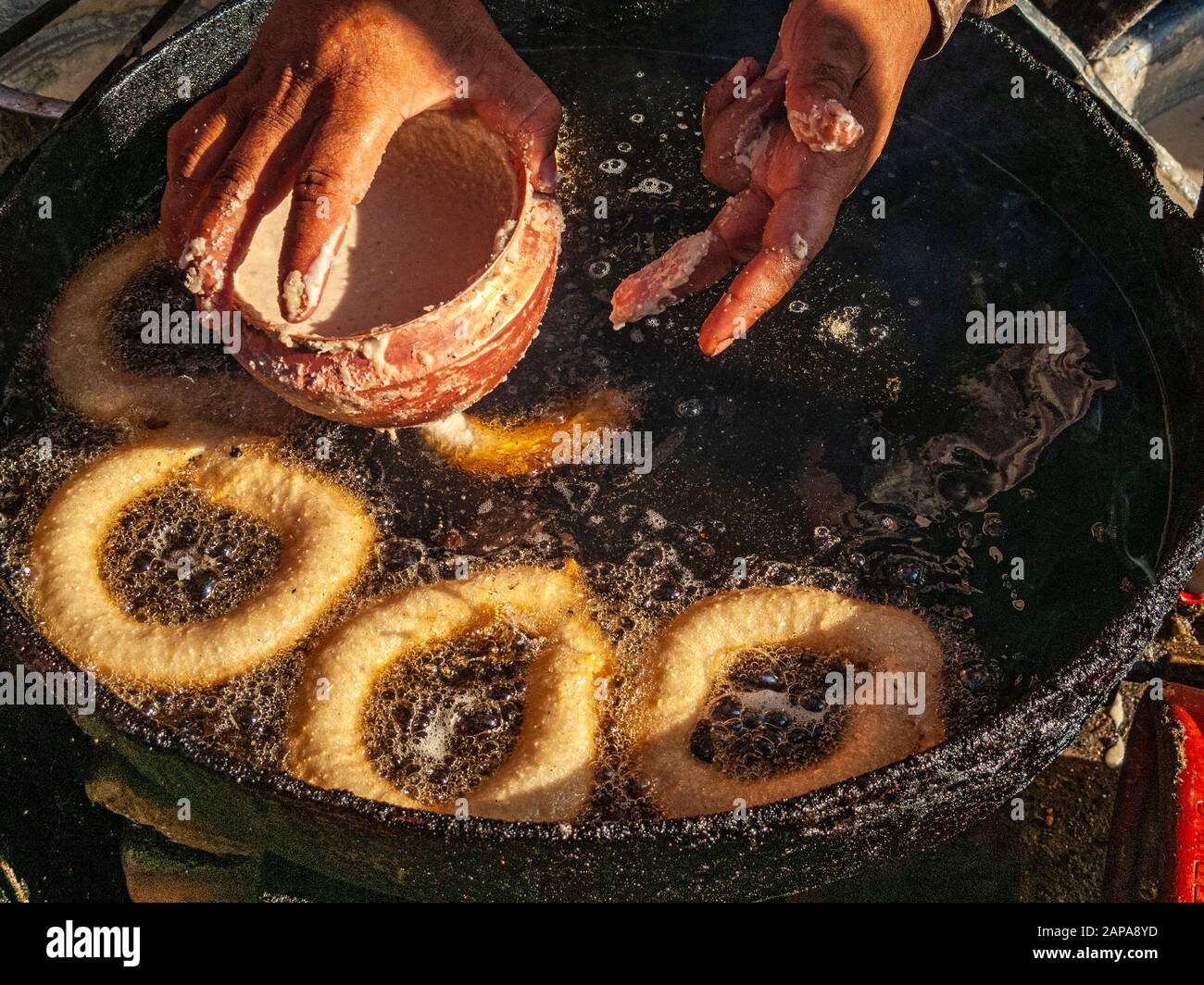 Detail of a vendor producing Sel Roti, the traditional breakfast for ...