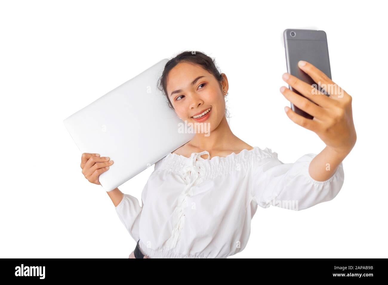 An Asian girl is taking selfie with her new gray laptop Stock Photo - Alamy