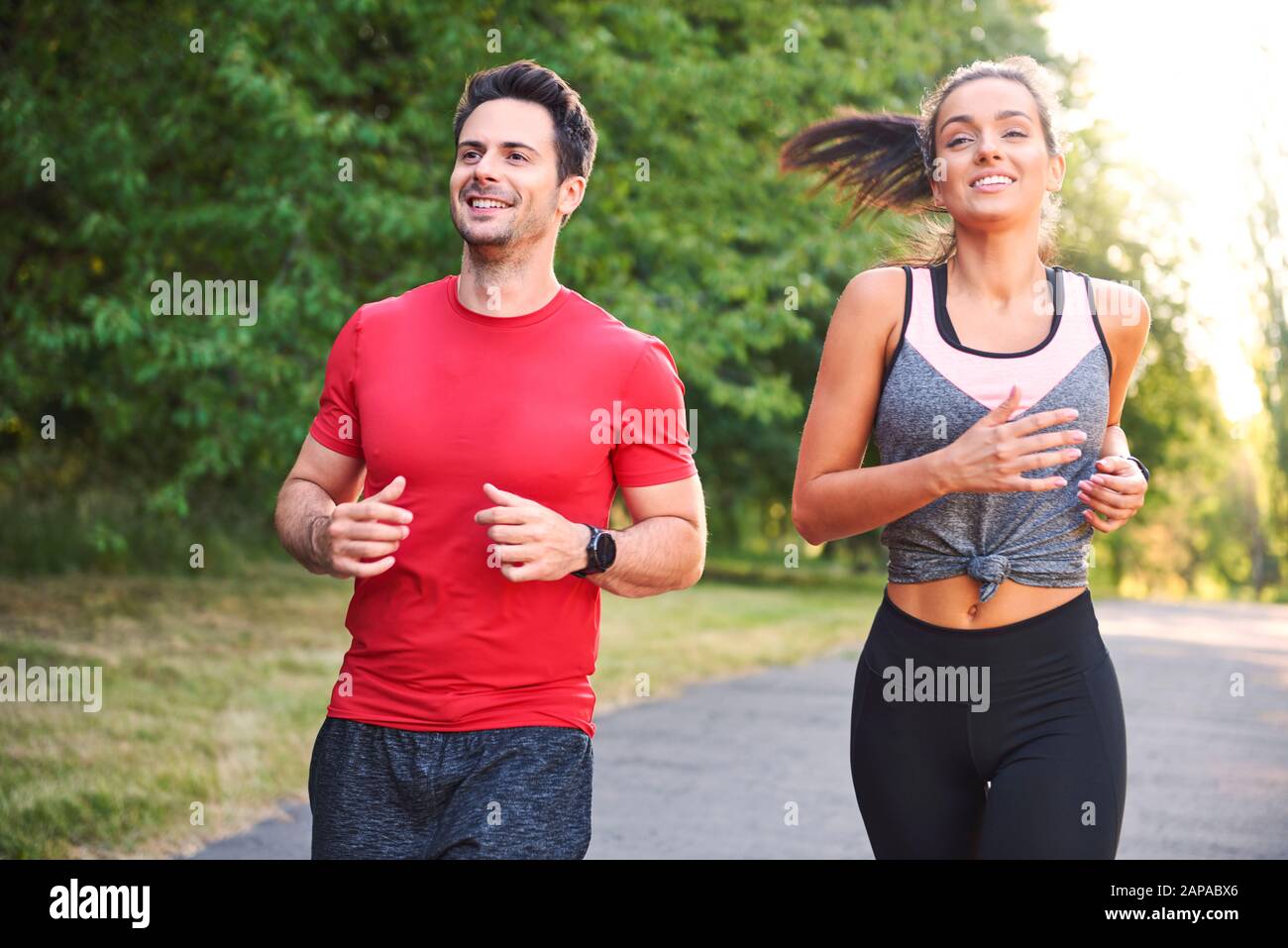 Positive young couple in park hi-res stock photography and images - Alamy