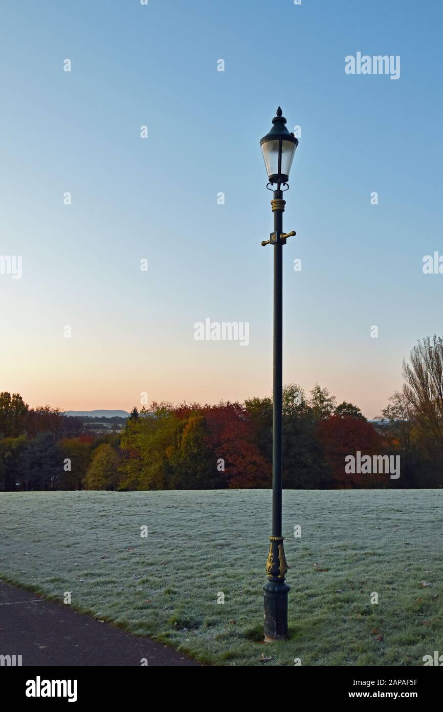 Old fashioned lamp post with bar near top for ladder. Taken in ...