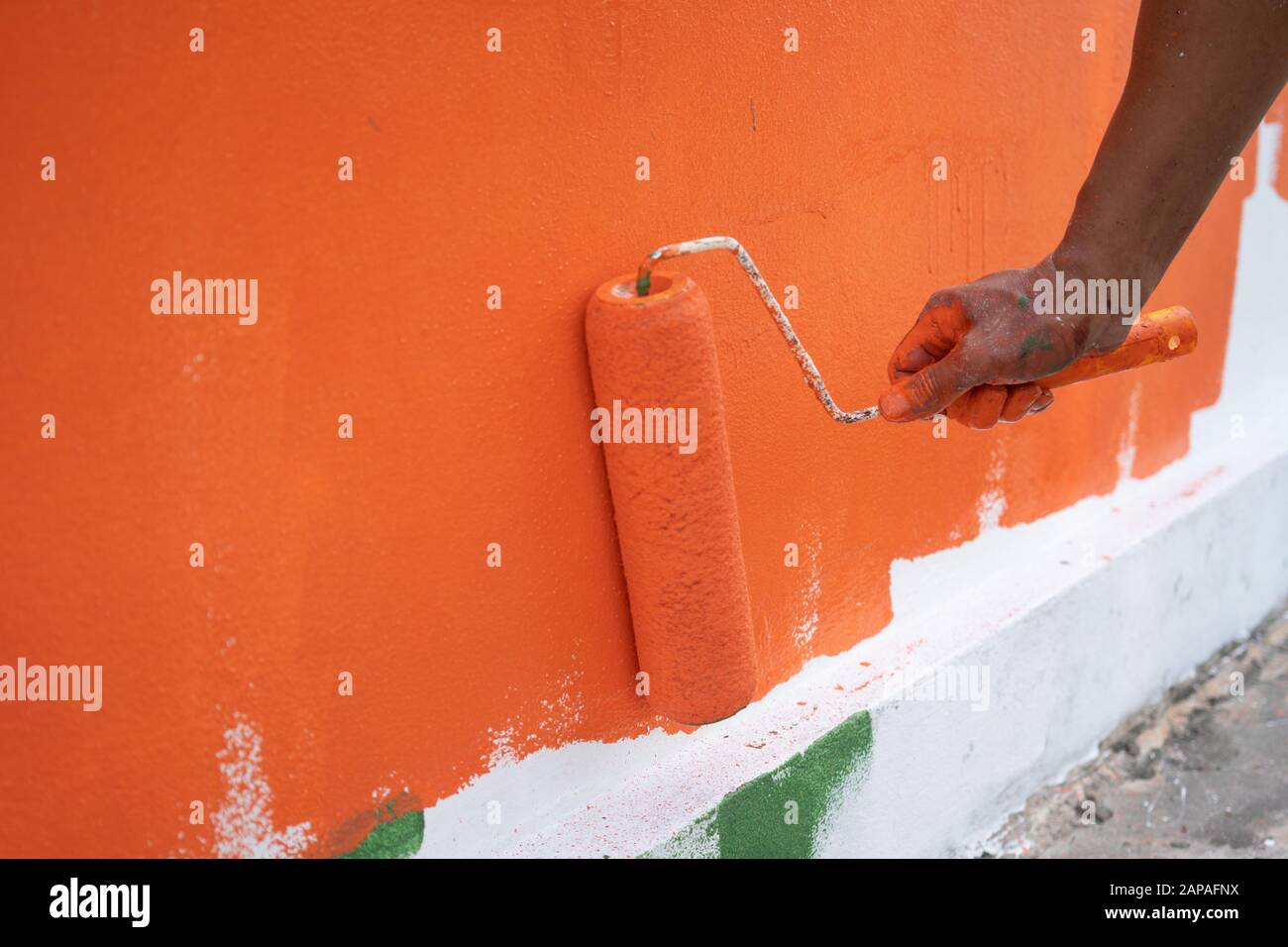 Painter labor Paint the wall using paint plots and rollers. Concepts of ...