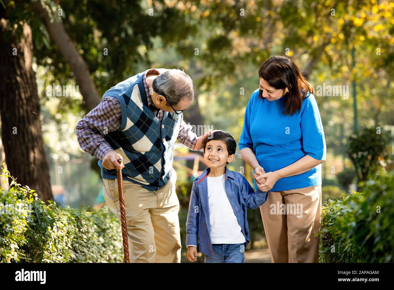 Happy grandparents spending leisure time with little grandson Stock ...