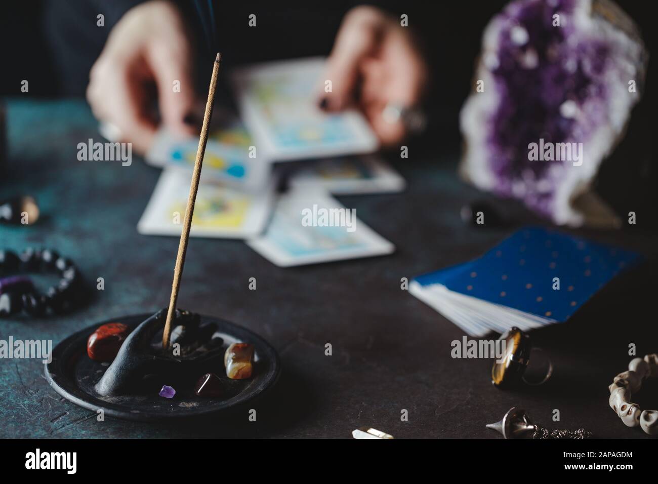 Witch predicts and reads the future through the use of Tarot cards ...