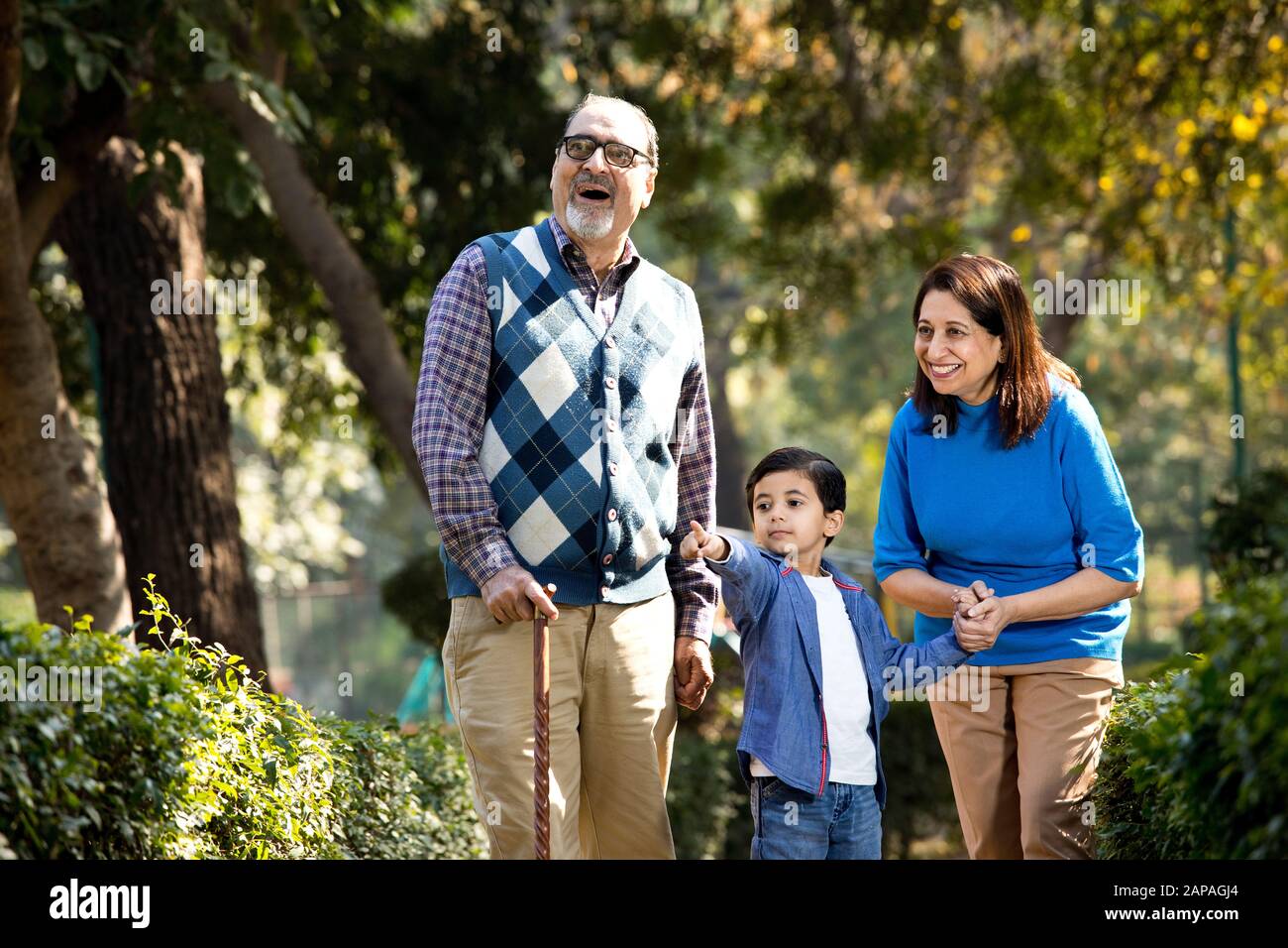 Happy grandparents spending leisure time with little grandson Stock ...