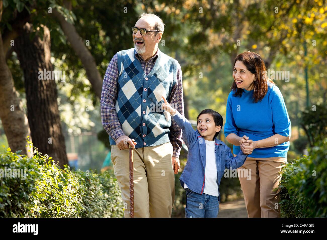 Happy grandparents spending leisure time with little grandson Stock ...