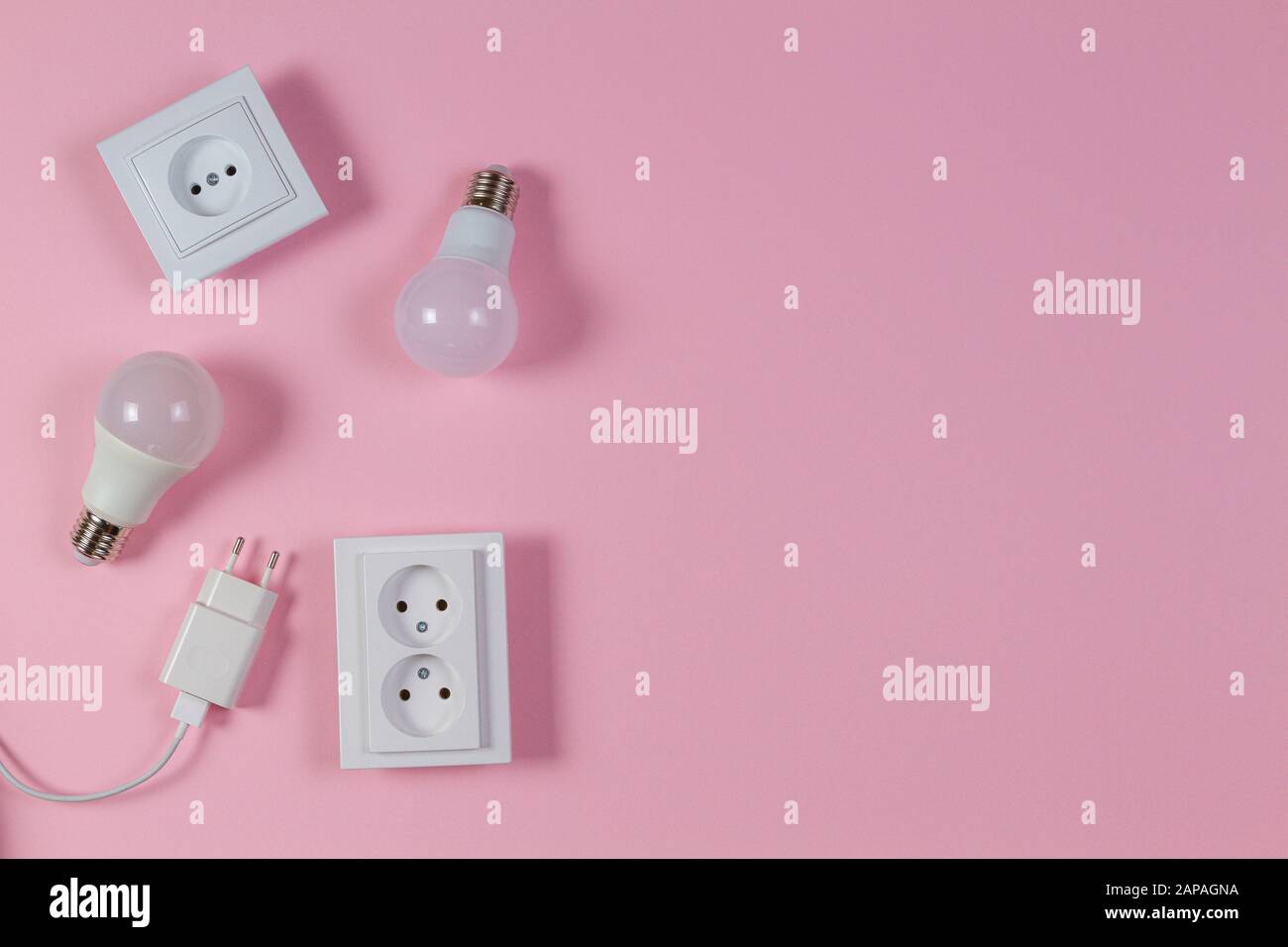 White electrical power sockets, power plugs, light lamp bulbs on light ...