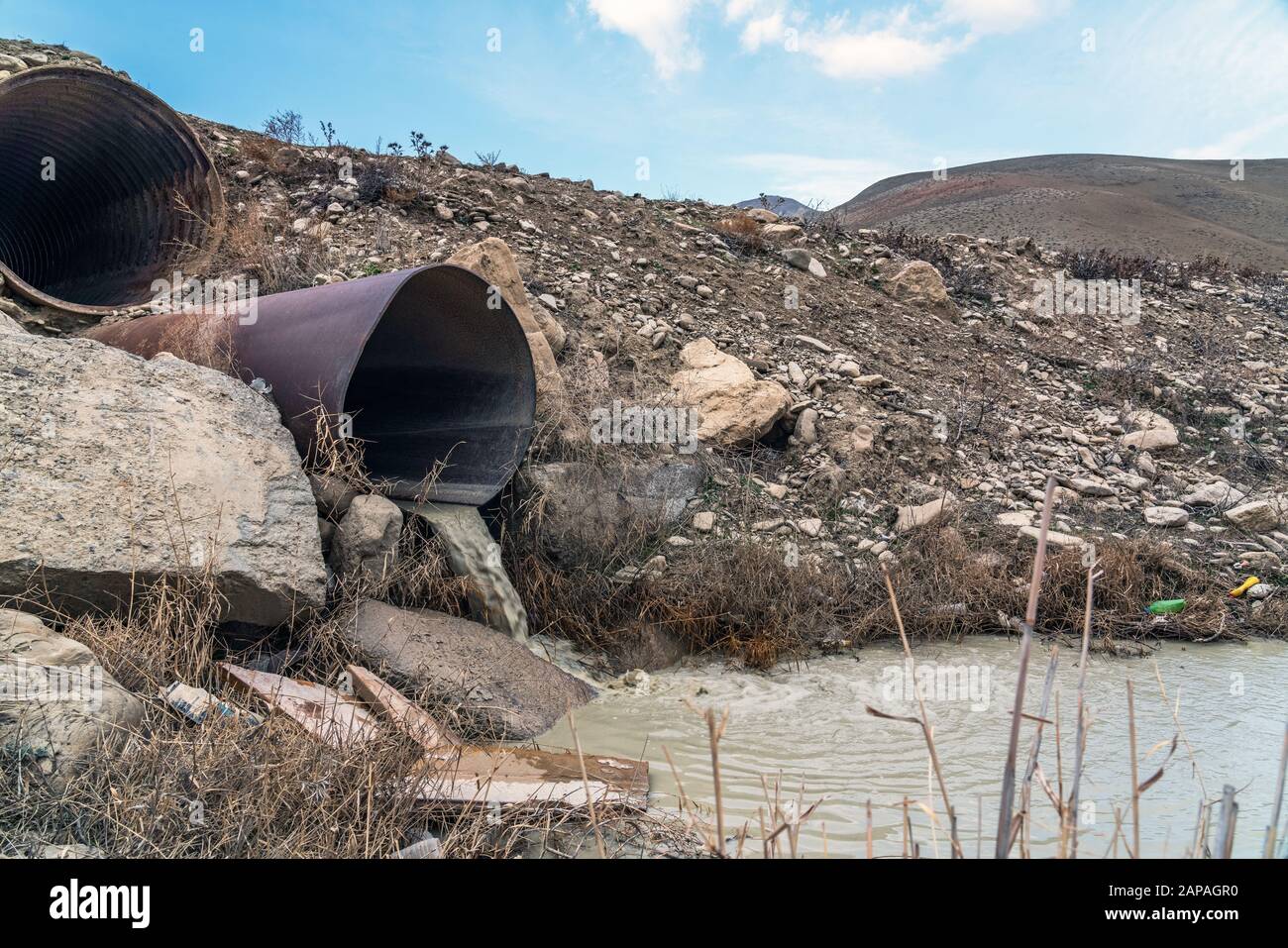 Dirty waste water from the pipe, environmental pollution Stock Photo ...
