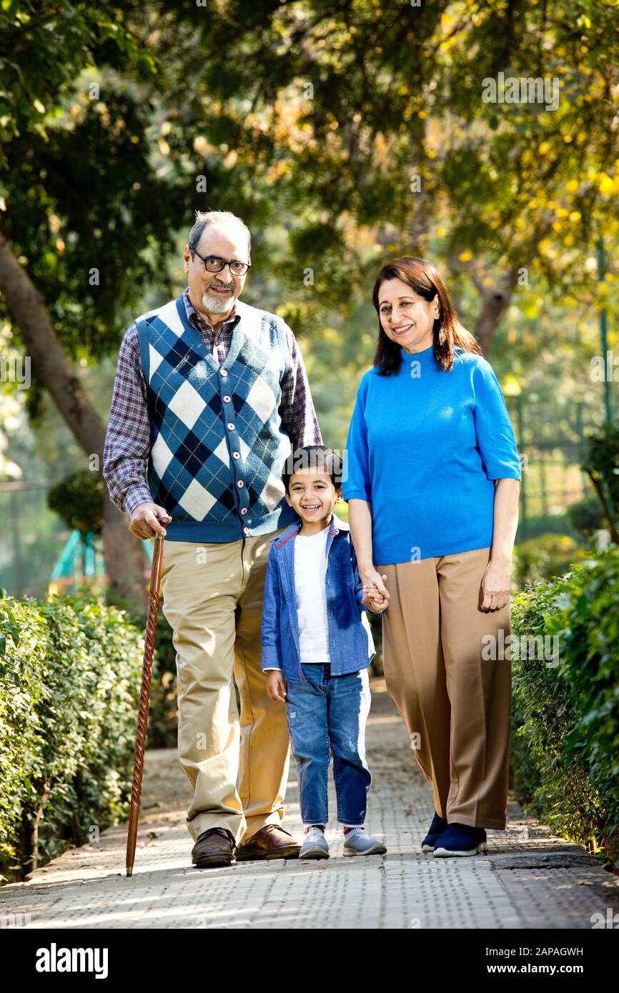 Happy grandparents spending leisure time with little grandson Stock ...