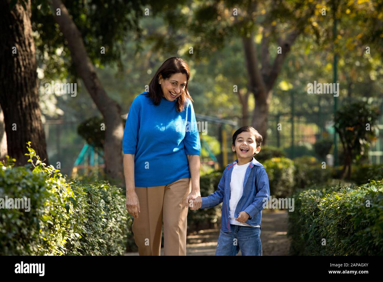 Cheerful grandmother spending leisure time with grandson Stock Photo ...
