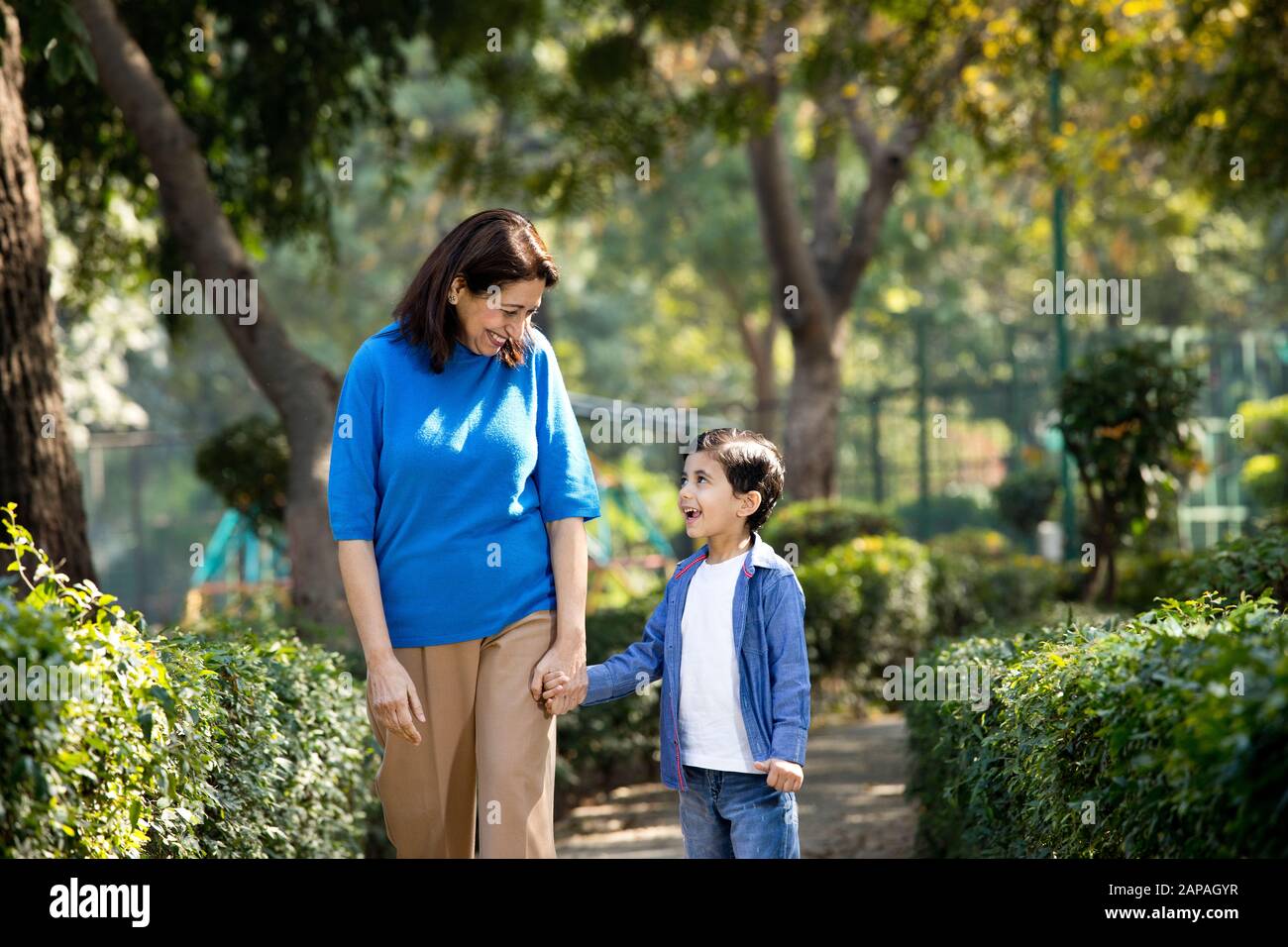 Cheerful grandmother spending leisure time with grandson Stock Photo ...