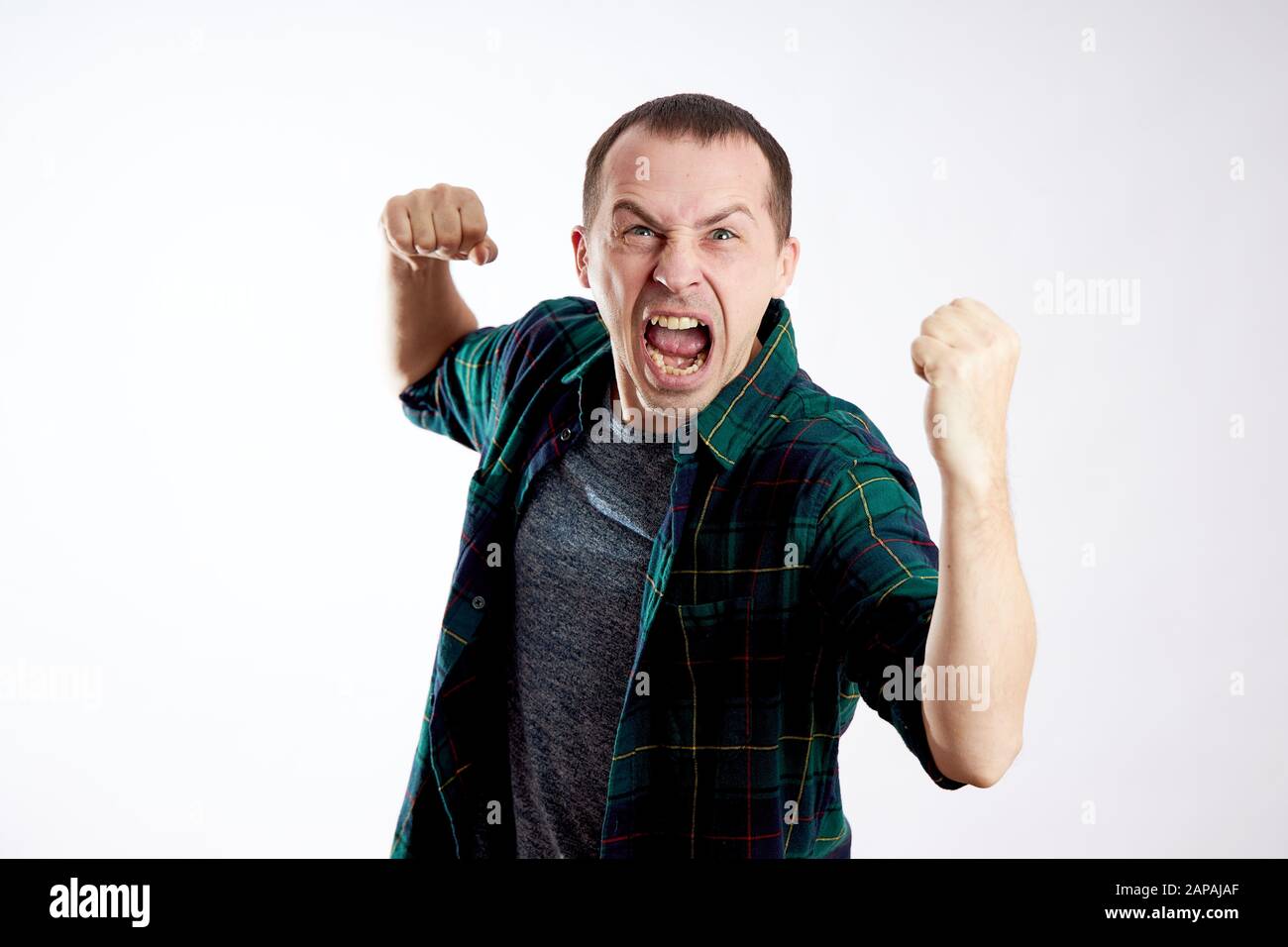 Man in anger shouts, domestic violence, irritation, an angry expression ...