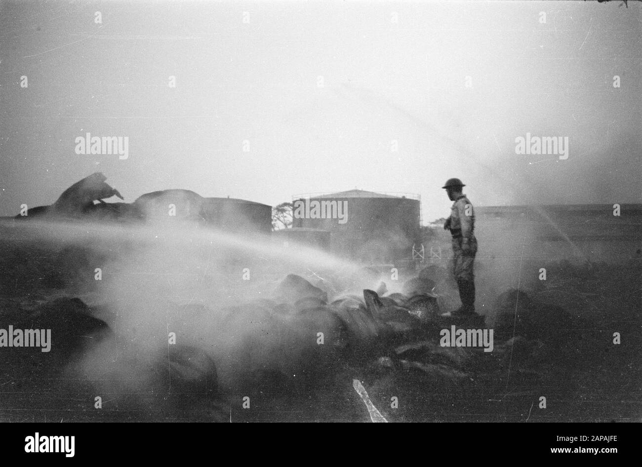 [Fire brigade fighting a fire on a factory site] Date: april 1947 ...