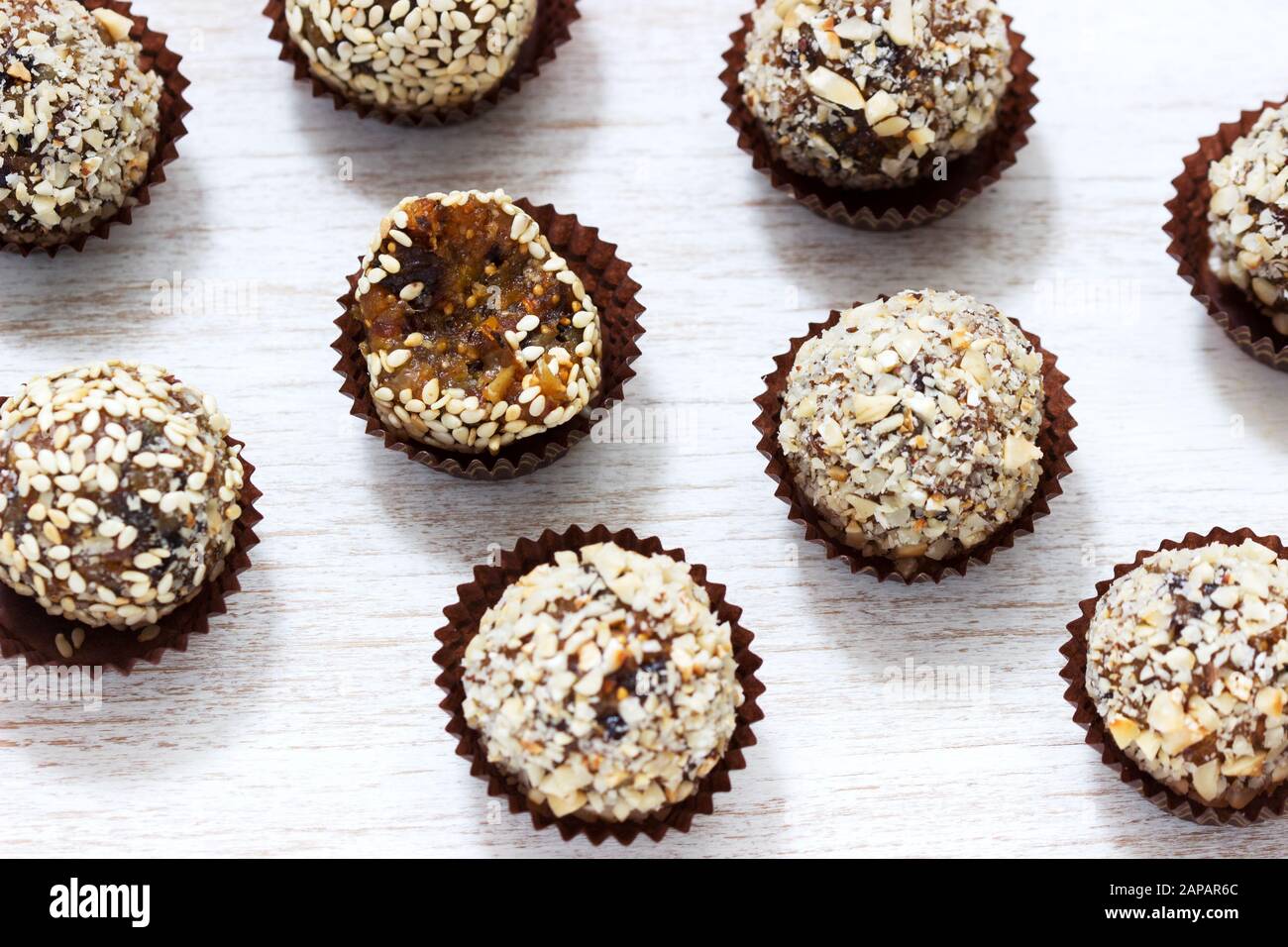 Homemade healthy candy made from dried fruits, honey and nuts. Rustic ...